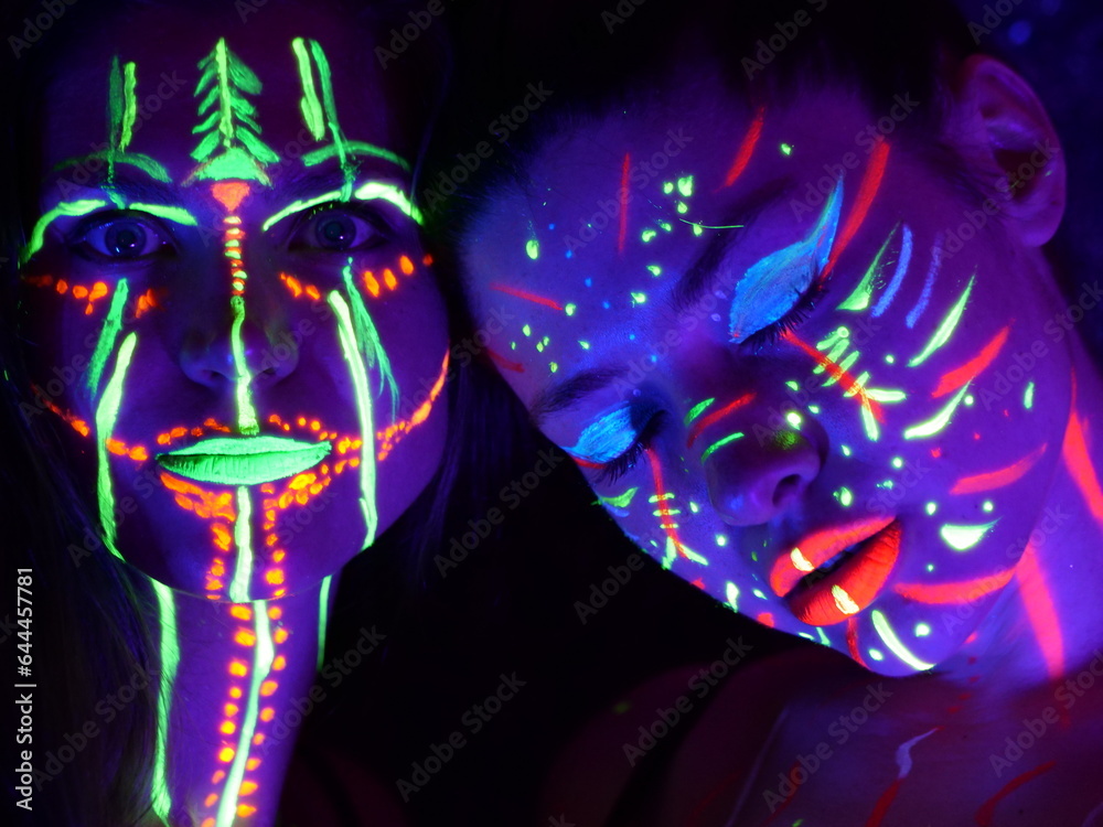 2 girls sensual posing with neon bodypainting colors Stock Photo ...