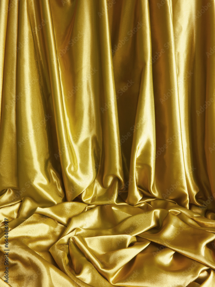 Elegant smooth golden satin, silk fabric drapes. Luxurious cloth ...