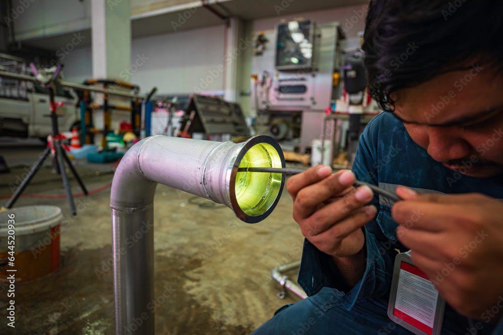 A man starts using a weld pipe stainless inspection camera. The light ...