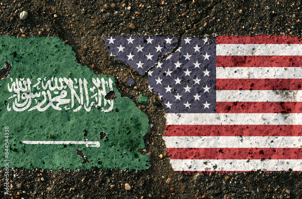 On the pavement are images of the flags of Saudi Arabia and the United ...
