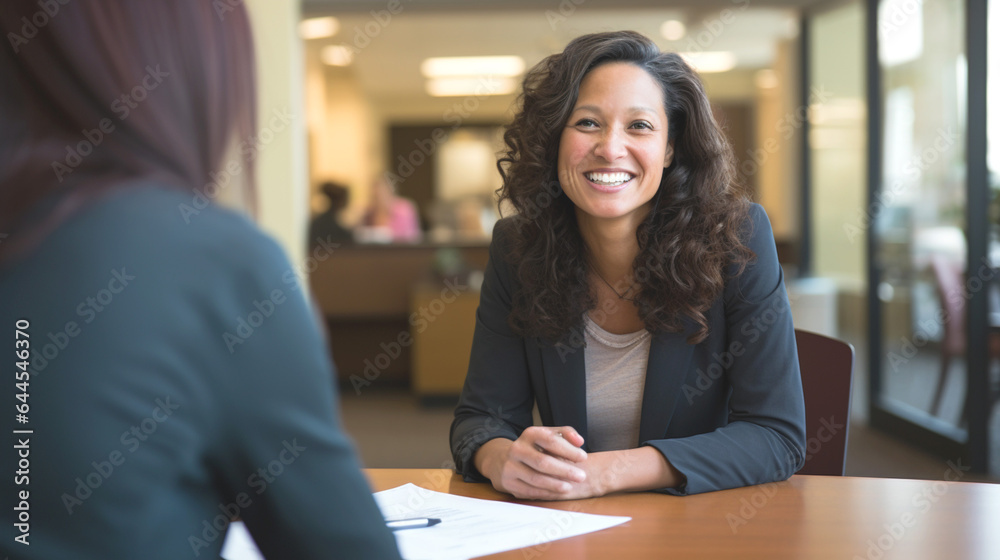 Ones late twenties woman doing job interview with woman boss. They are ...