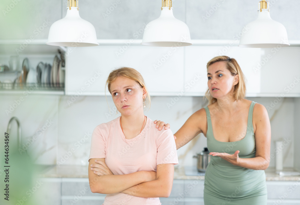 Blurry unrecognizable angry mother yells at teenage girl. Concept of ...