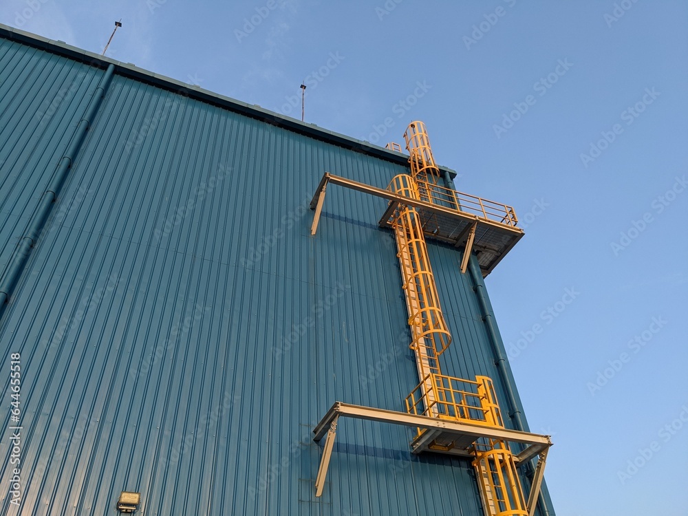 Ledder and cage rail on the wall power plant industry. The photo is ...