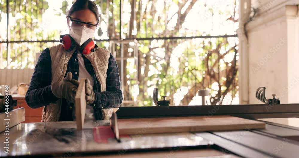 Carpenter woman, table saw and cut wood for construction, check and ...