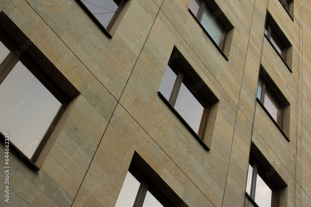 Urban city background. Facade of a concrete building with windows ...