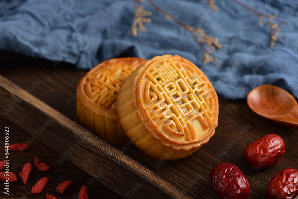 The Mid-Autumn Festival moon cake on the retro background. The Chinese ...