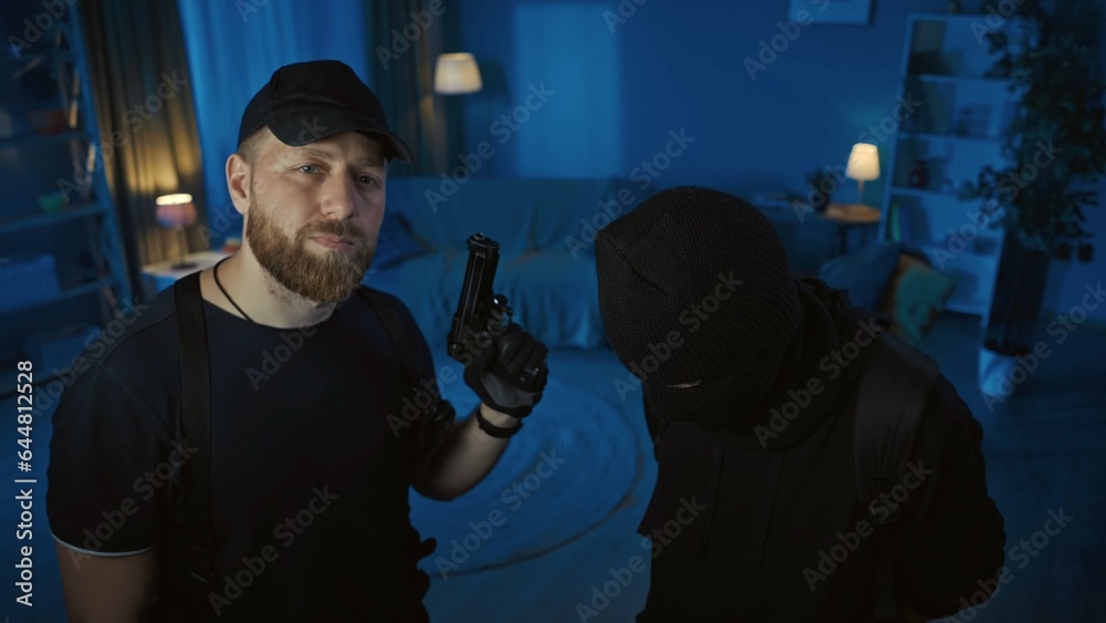 Shot of a policeman, cop, looking at the camera, standing next to the ...