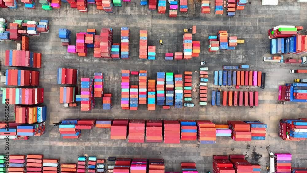 Video Stock A sprawling container yard, bustling with activity, seen ...