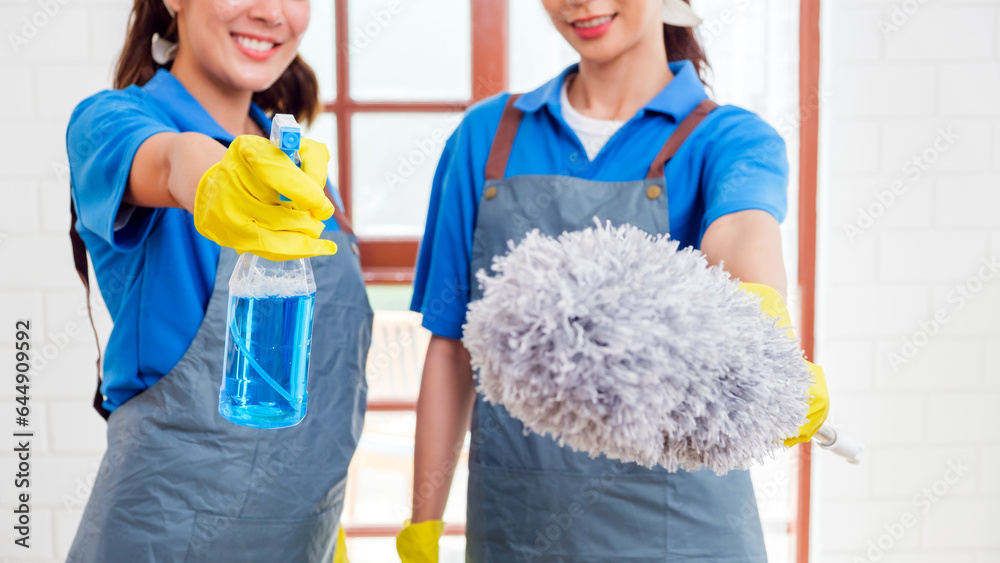 Crop image of Asian young cleaning service women worker team working in the house. Girls ...