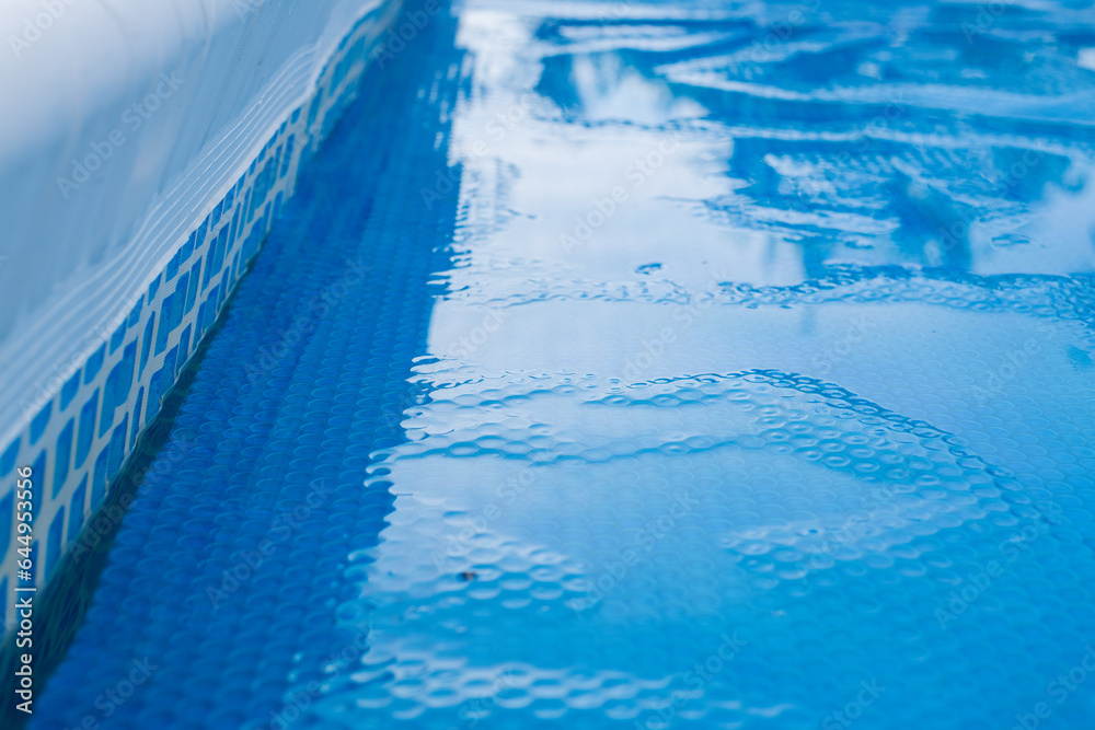 Swimming Pool with solar film covers the pool. Film for heating water ...