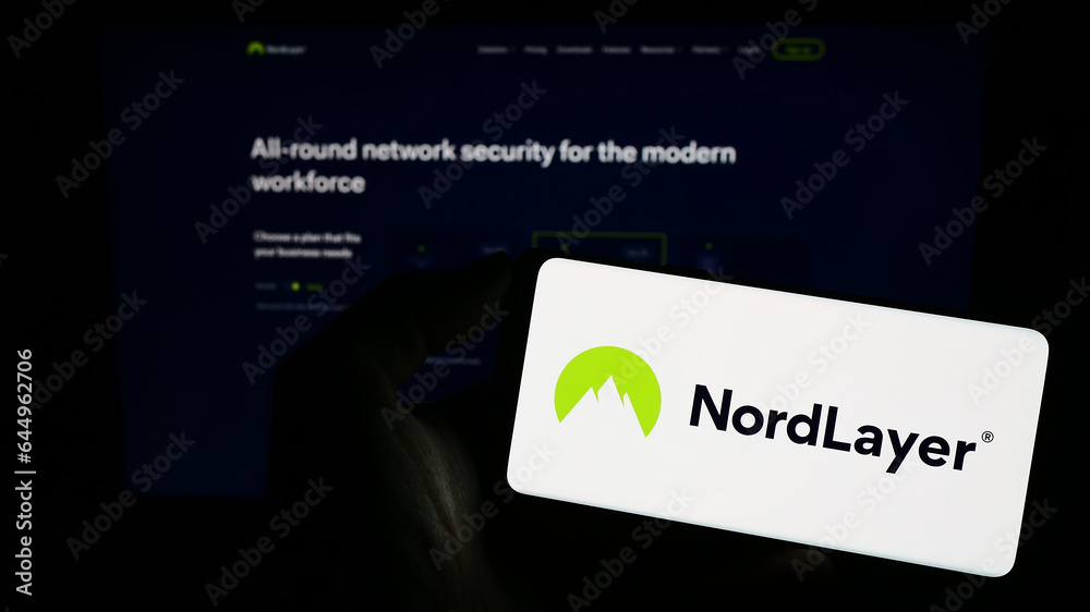 Stuttgart, Germany - 09-02-2023: Person holding mobile phone with logo of network access ...