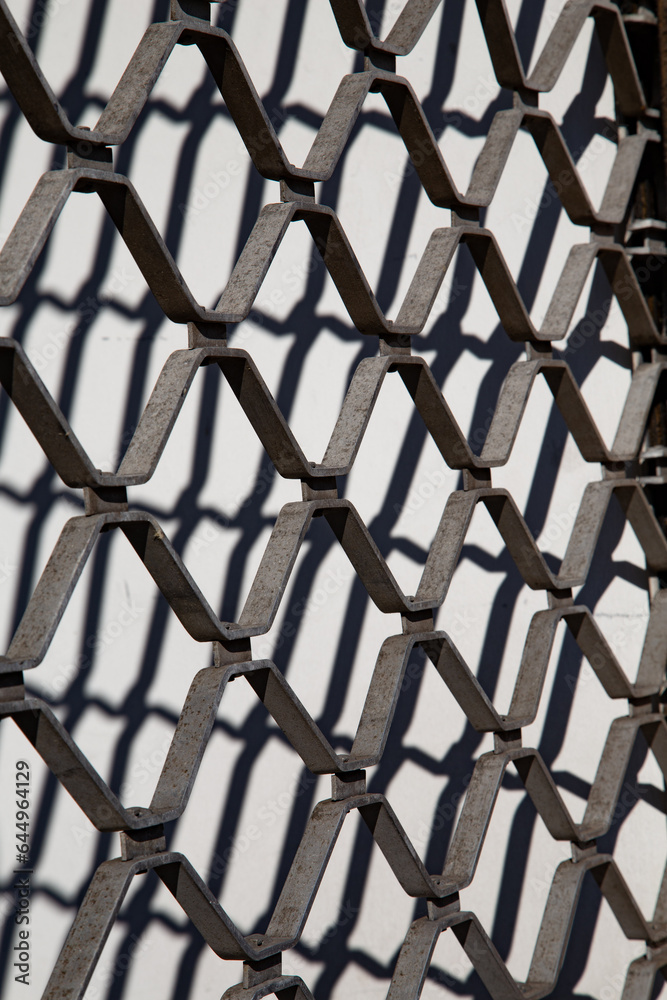 metal grid texture in detail gives a harmonic background symbolizing ...
