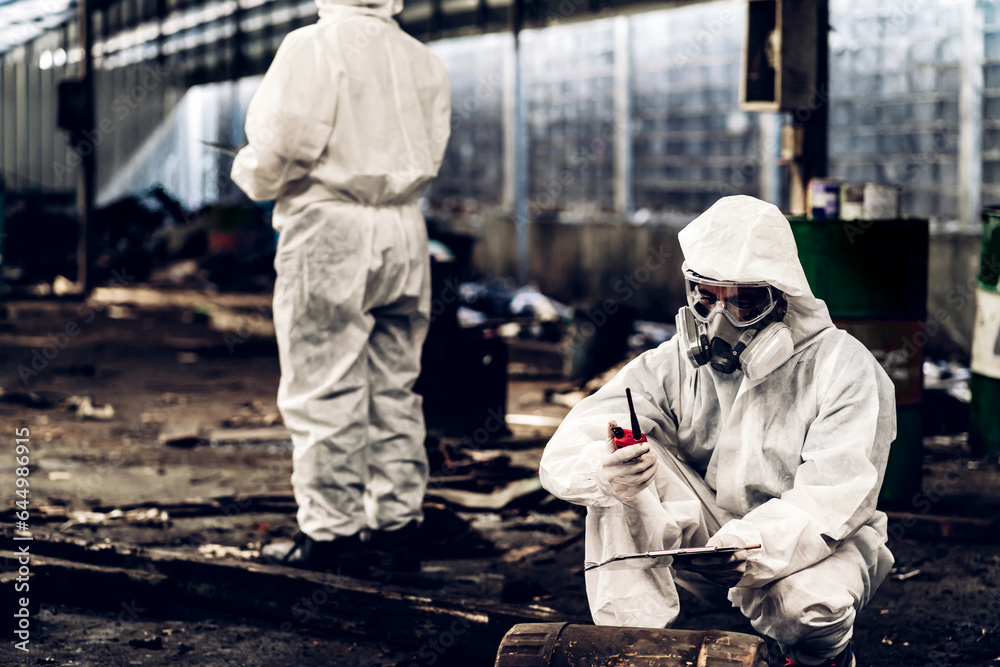 Scientist wear Chemical protection suit check danger chemical, working ...