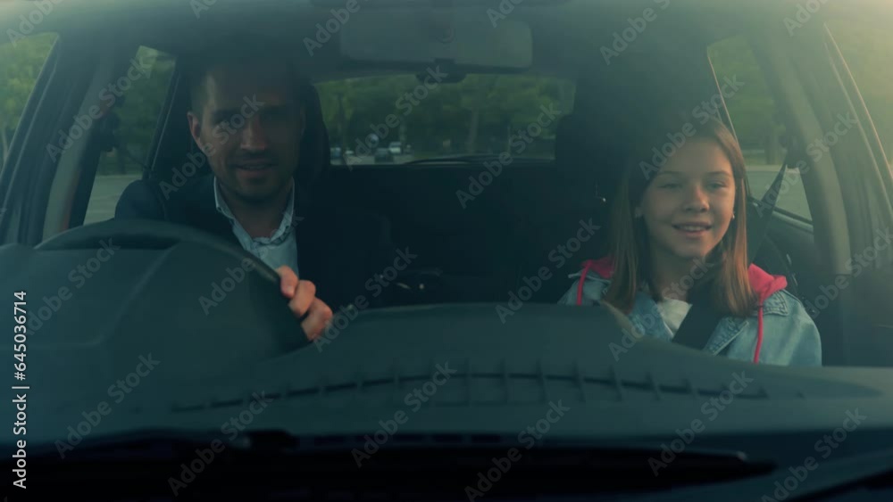 Cute teen daughter spending time with her father in the car in the city ...
