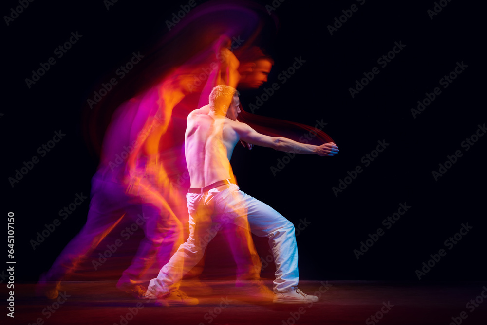 Inner fight. Muscular, shirtless, young guy in motion against black ...