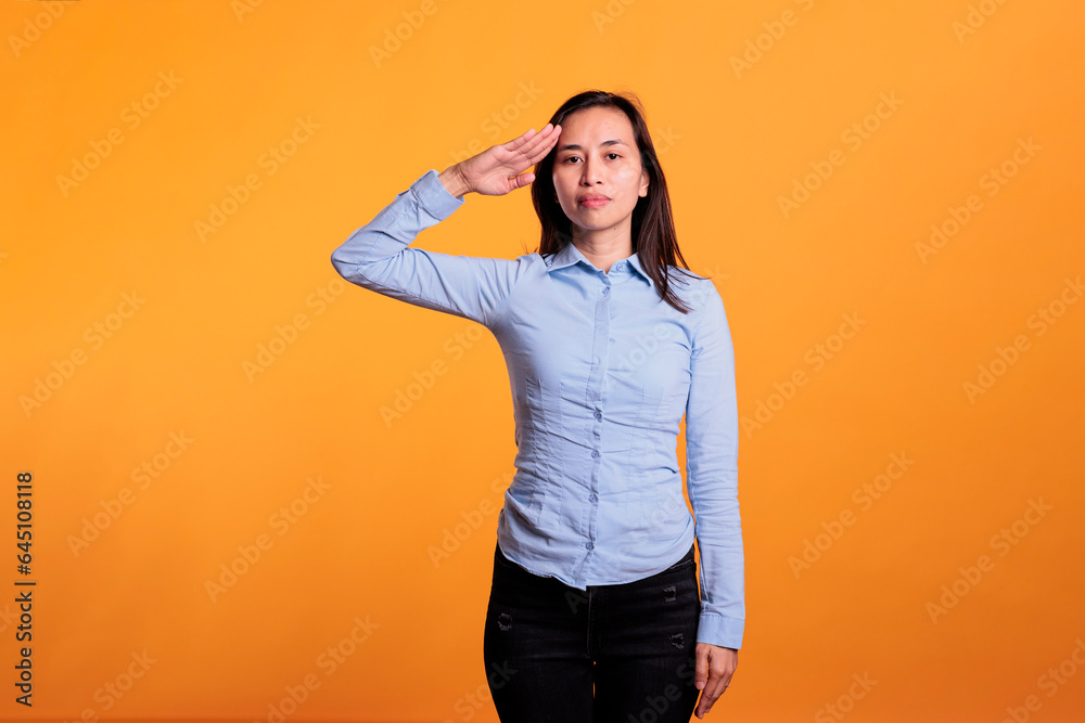 Filipino patriot woman doing military salute with hand over forehead ...