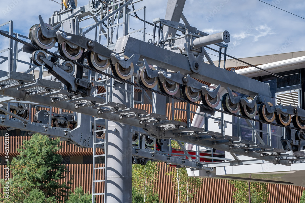 Ropeway mechanism and cable support pylon. Close-up of a cable car ...