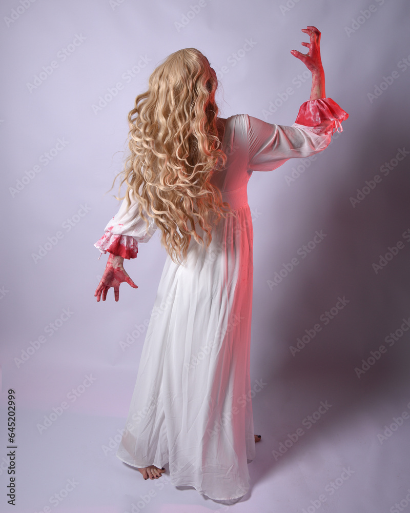 Full length portrait of scary vampire zombie bride, wearing elegant ...