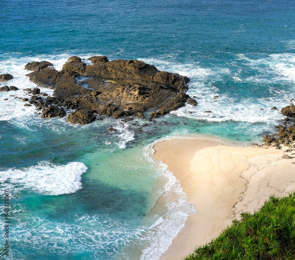 view of the beach and rocks from the top of the merese hill in Lombok ...