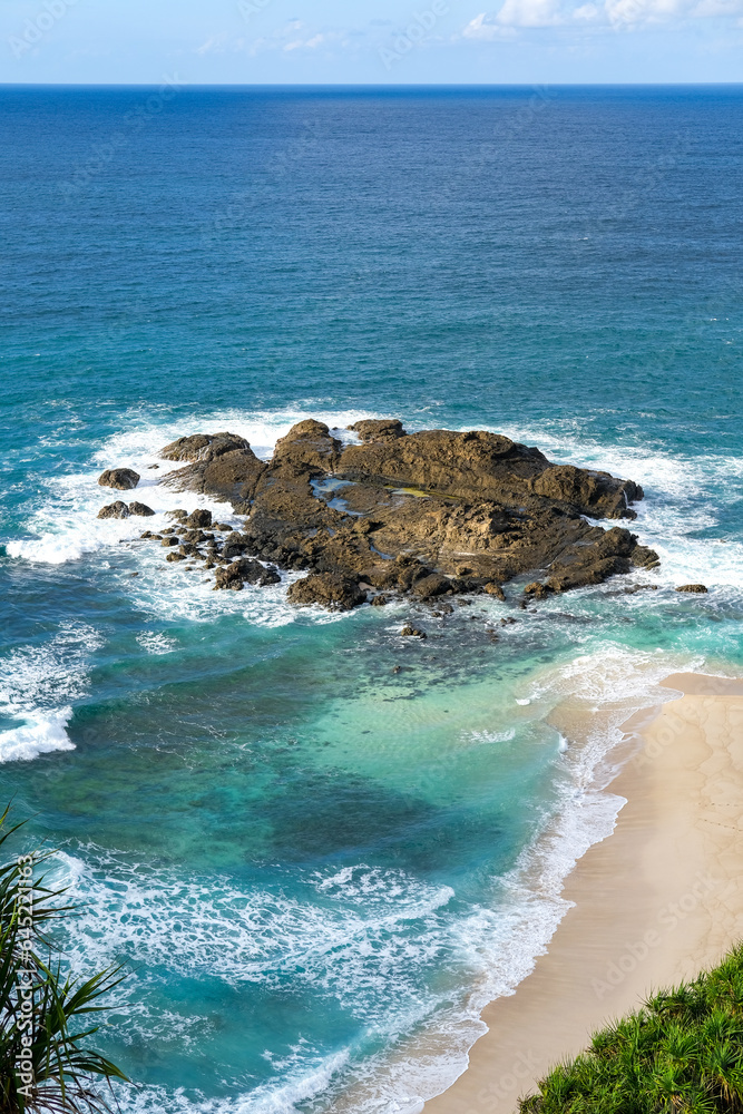 view of the beach and rocks from the top of the merese hill in Lombok ...