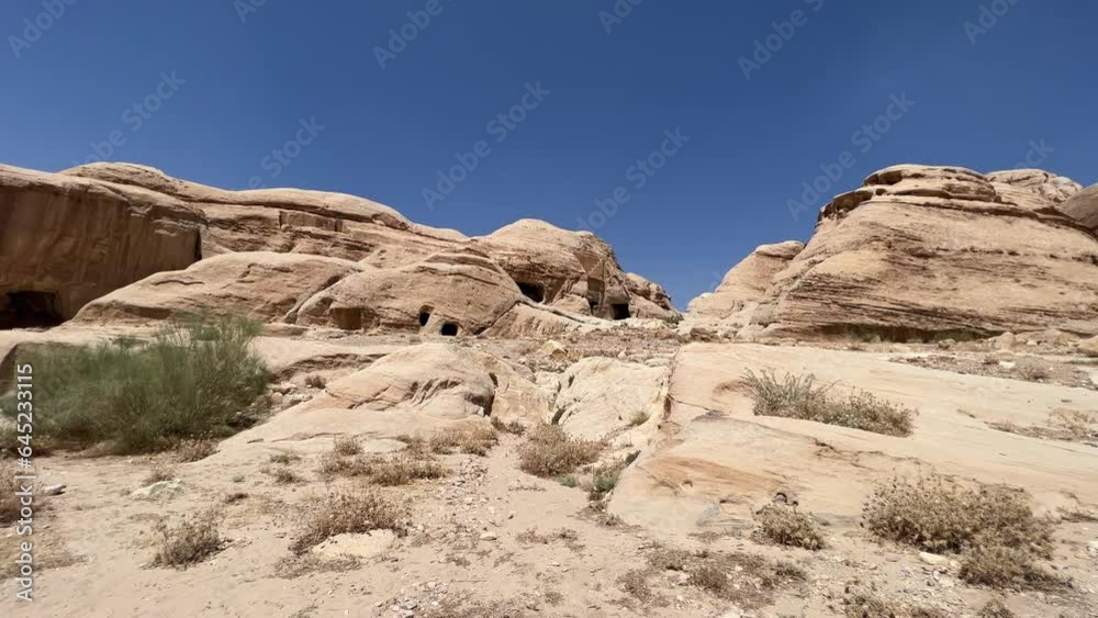 Petra valley in Wadi Musa, Jordan with The Treasury in the middle of a ...