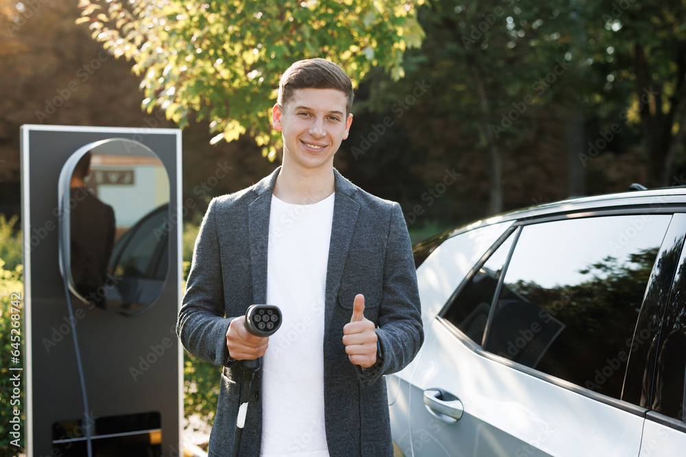 Happy confident young professional business man leader winner employee ...