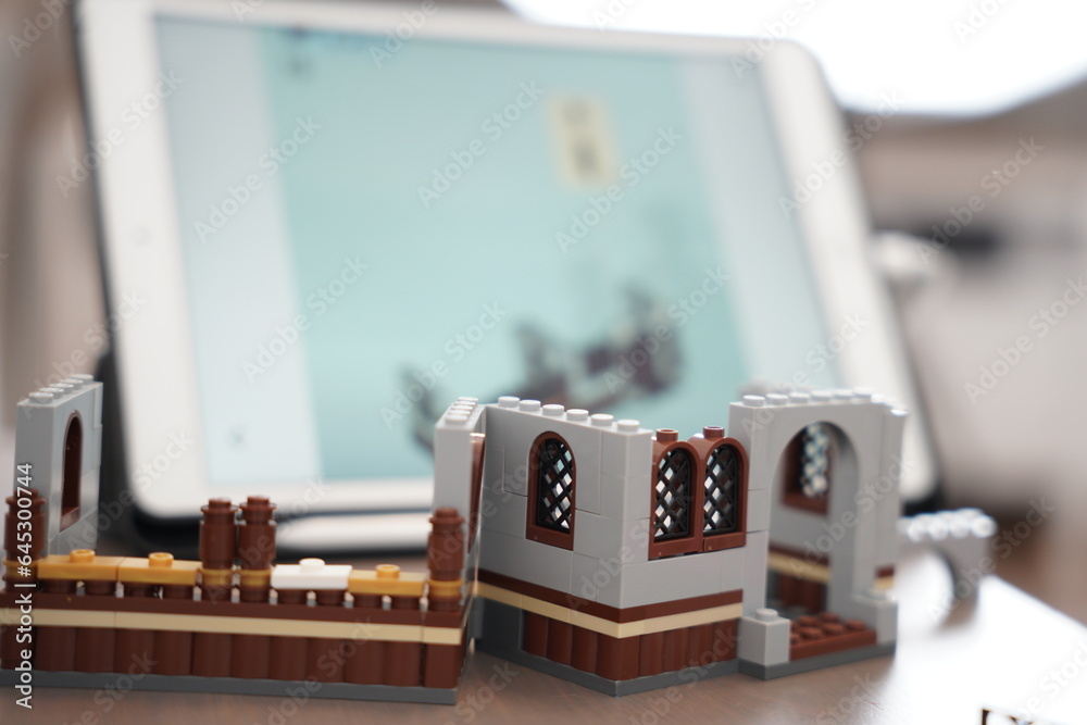 lego medieval market village 1601, A person is building a lego house ...