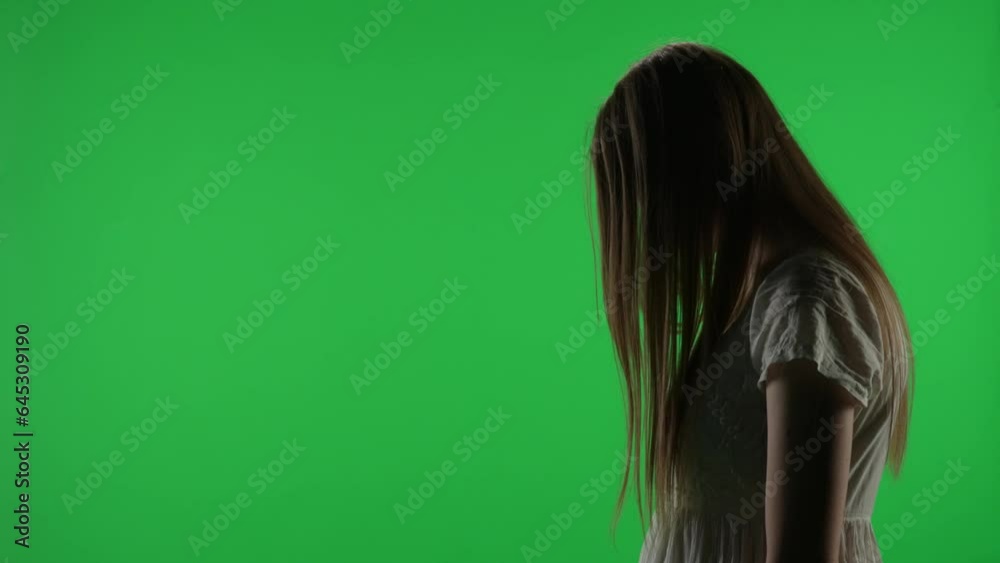 Medium side view green screen, chroma key video of a posessed female ...
