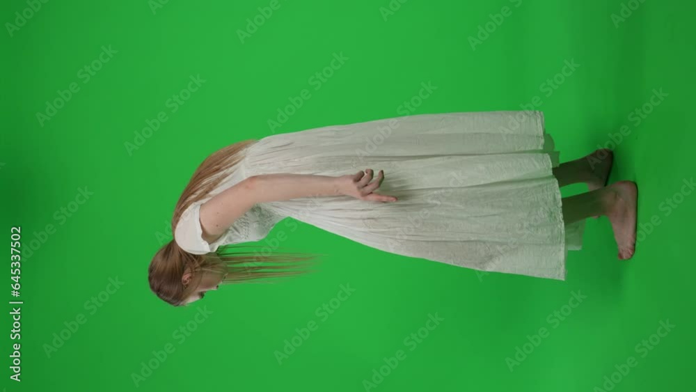 Full-size vertical green screen, chroma key video of a posessed female ...