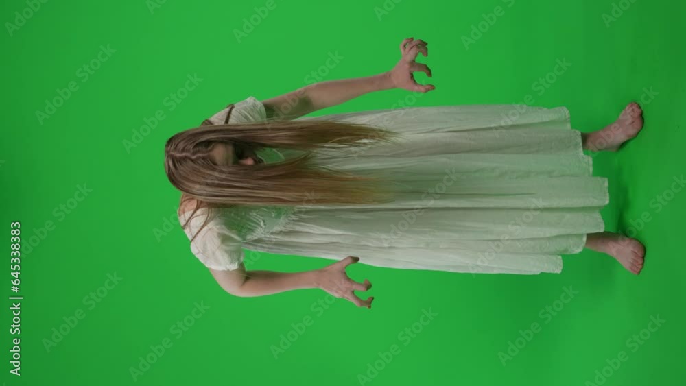 Full-size vertical green screen, chroma key video of a posessed female ...