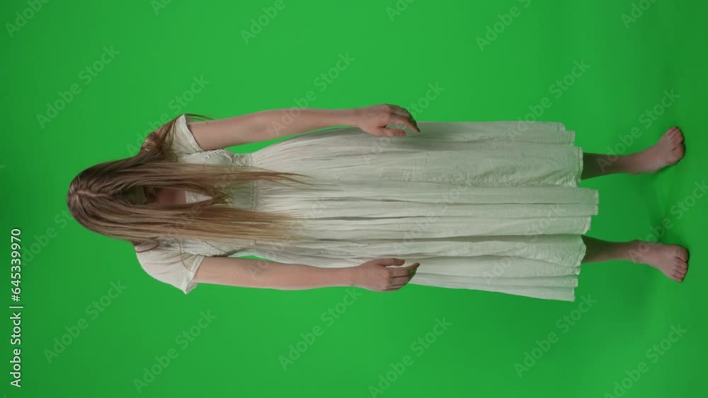 Full-size vertical green screen, chroma key video of a posessed female ...