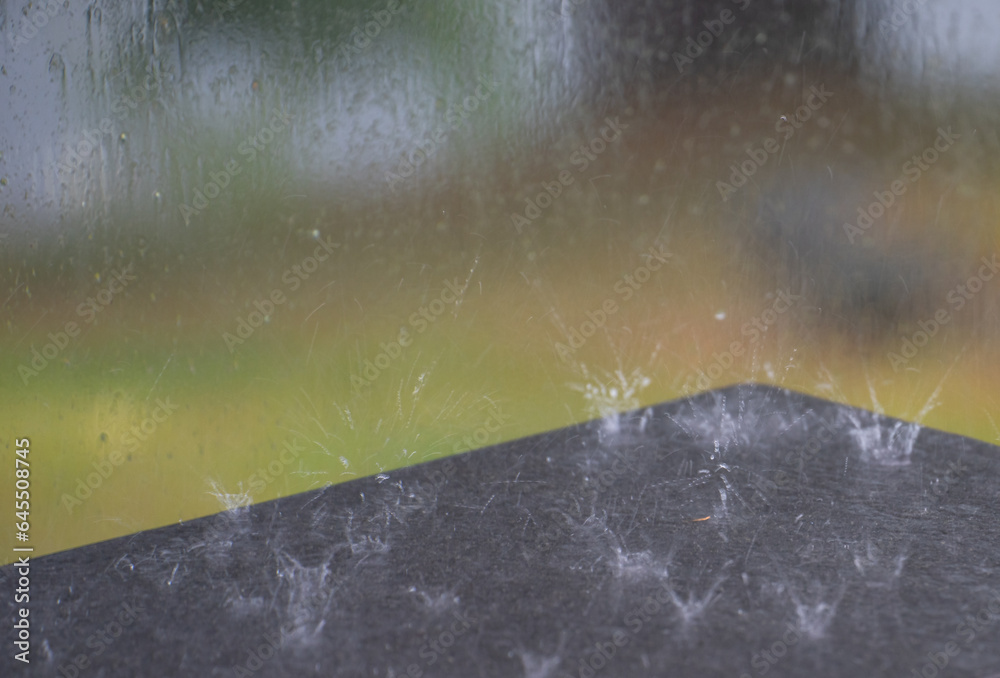 rain drops falling in deck railing surface making splashes raindrop ...