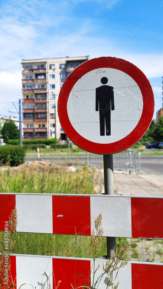 No pedestrians. View of pedestrians prohibited sign and roadblock in ... No pedestrians. View of pedestrians prohibited sign and roadblock in ...
