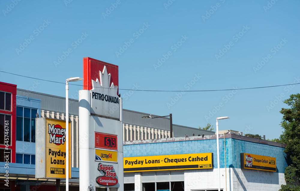 Petro Canada signage with other business signs in Toronto, Canada Stock ...