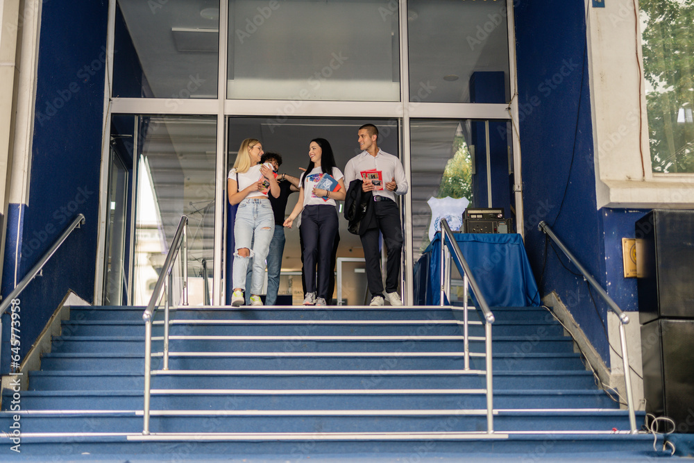 Happy, smiley university students having fun conversation and smiling ...
