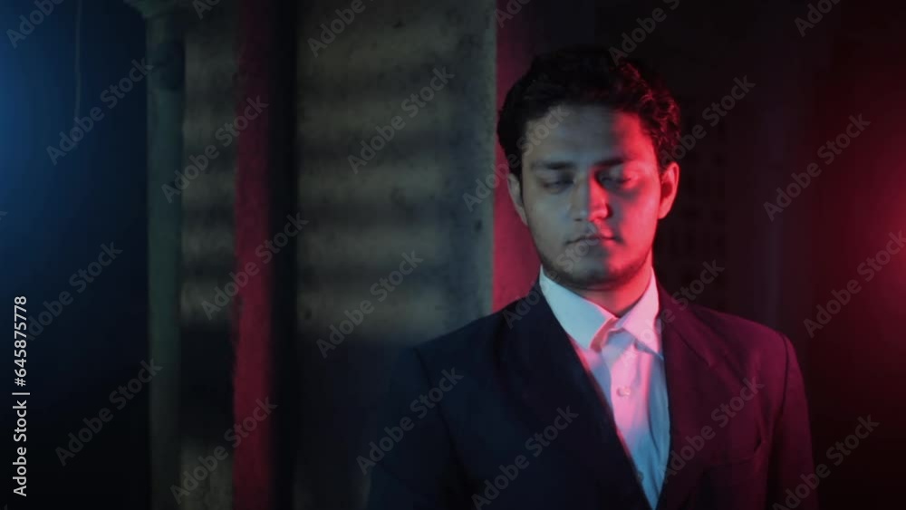 Futuristic shot of a man-killer gangster dressed in a suit and pointing ...