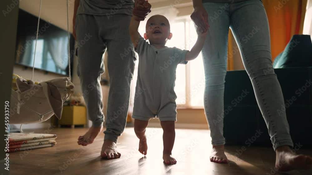 First steps. Family day. toddler takes first steps at home across field ...