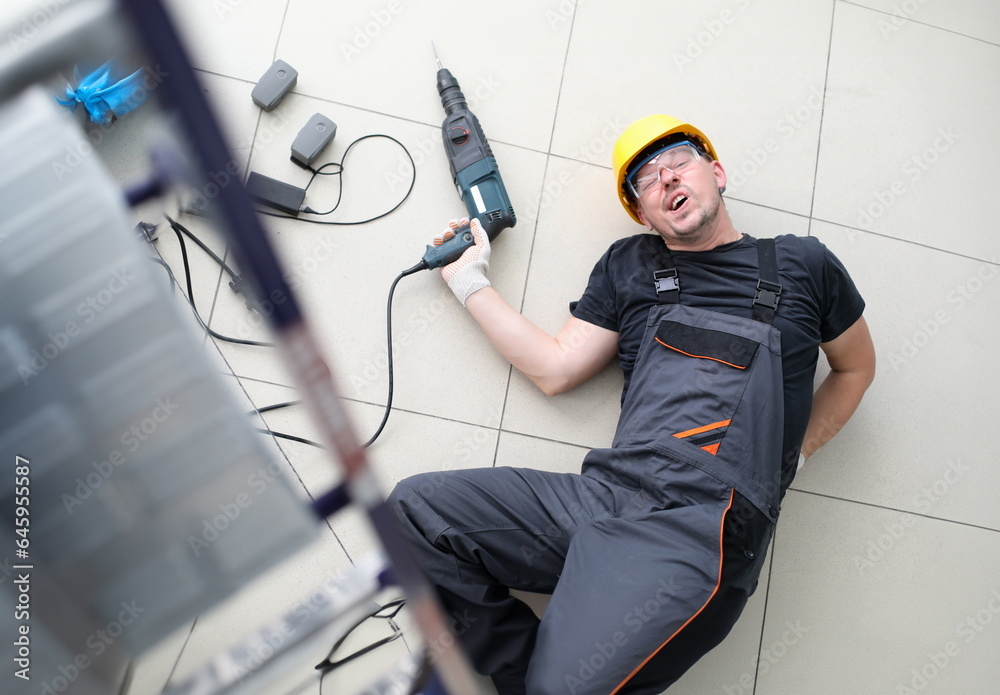 Occupational Safety and Health concept. Male worker with power tool in ...