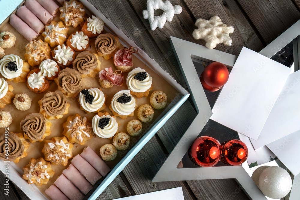 Festive savory profiteroles with caviar, cream cheese and dill in a ...