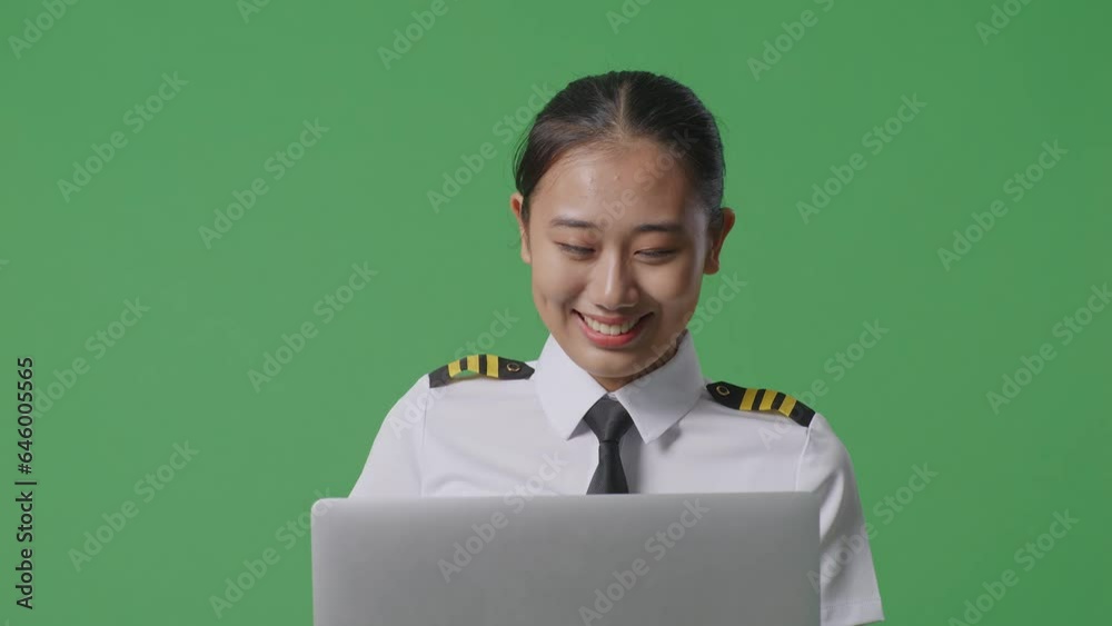 Close Up Of Asian Woman Pilot Using A Laptop And Smiling To Camera ...