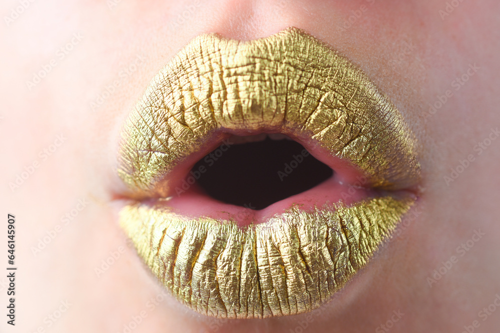 Surprised mouth. Close up woma face with gold lips. Gold paint on mouth ...