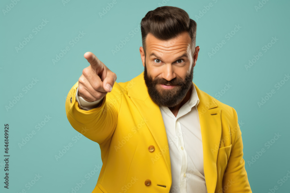 Man wearing bright yellow jacket is pointing directly at camera. This ...