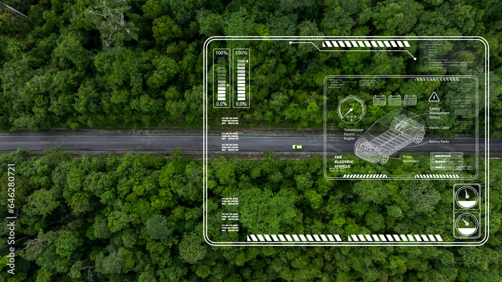 Aerial top view of green electric vehicle car driving over straight ...