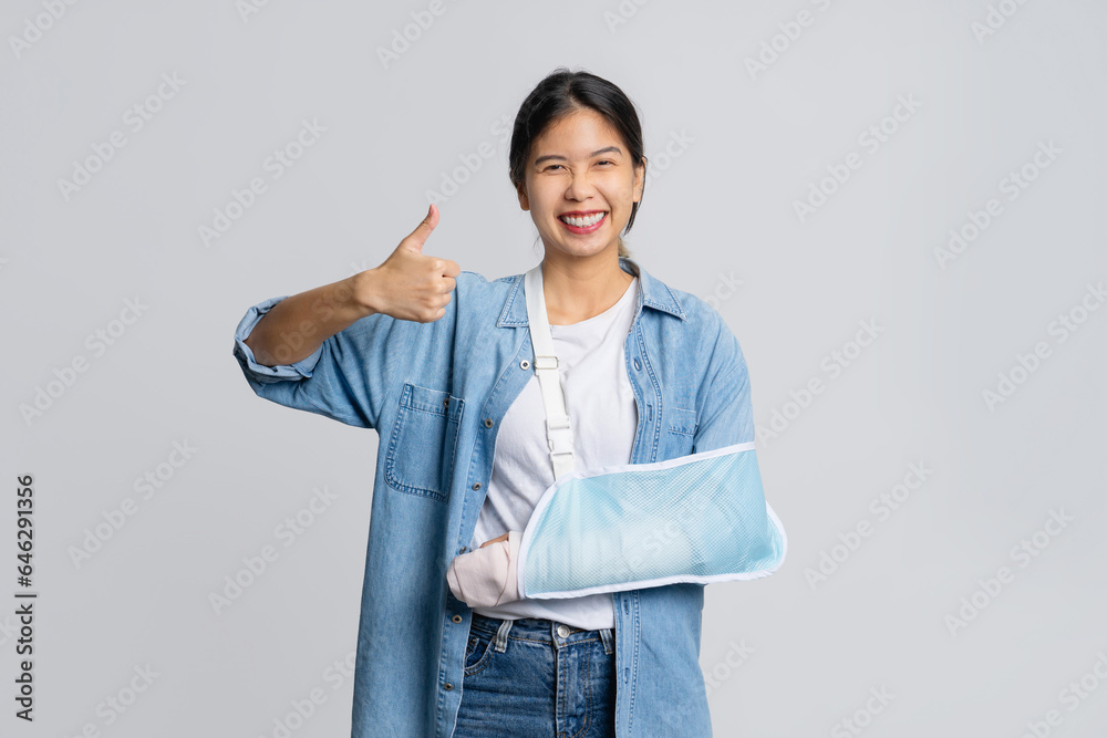 Poster Asian female patient wearing plaster cast and arm support after ...