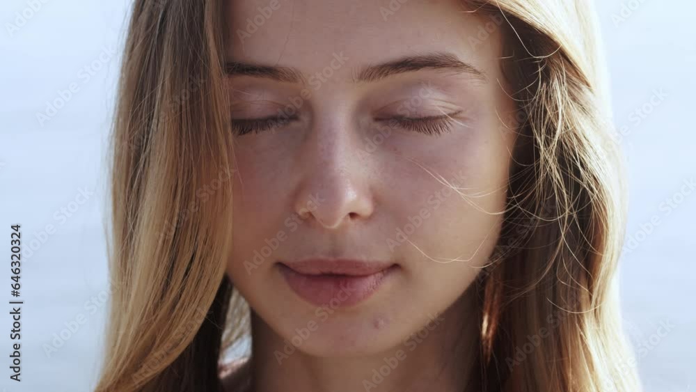 Close up of woman's face. Cute female opening her beautiful brown eyes ...