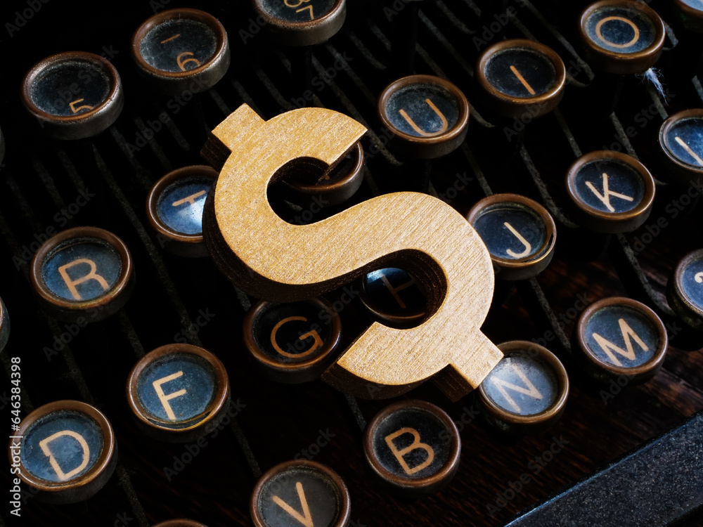 An old typewriter and a dollar sign as symbol of content monetization ...