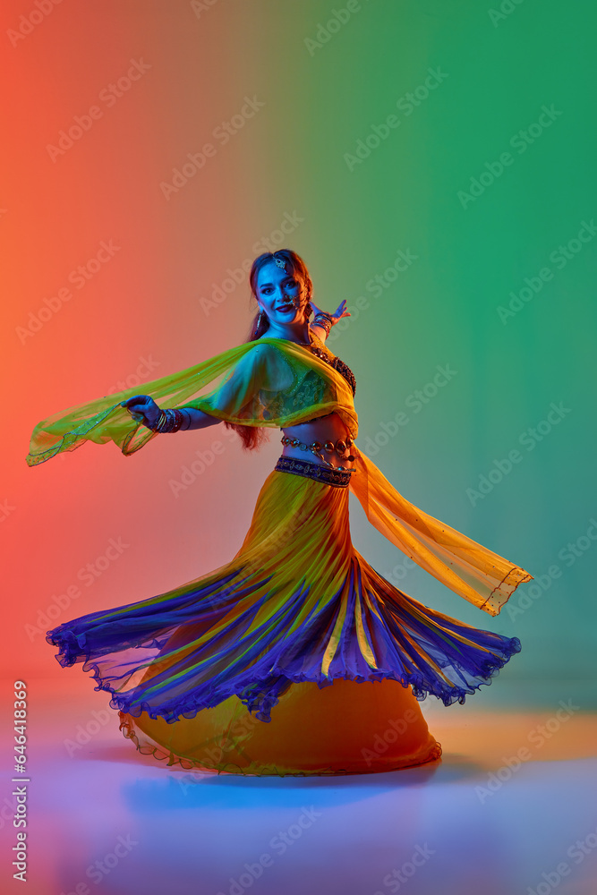 Indian culture. Beautiful woman in elegant dress dancing traditional ...