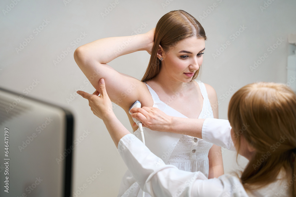 Cute young woman on procedure of ultrasound of lymph nodes Stock Photo ...