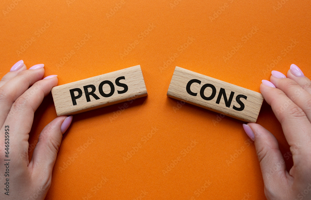 Pros vs Cons symbol. Concept word Pros vs Cons on wooden blocks ...