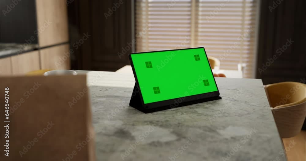 Tablet place on kitchen table, Green screen touchscreen, Close up ...